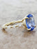 Coco: Cornflower Blue Oval Solitaire with Vintage-Inspired Diamond Band | Ken & Dana Design